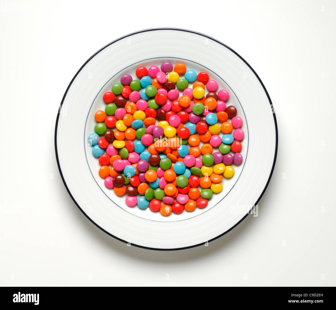 Plate with colour candy pieces Stock Photo - Alamy