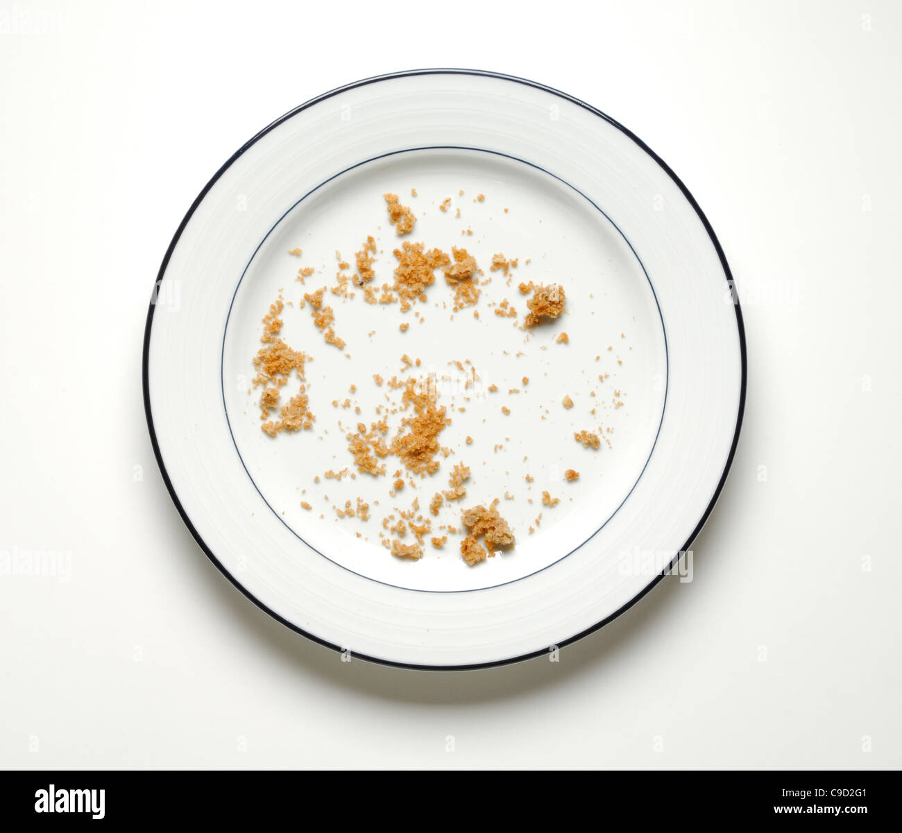 Plate with food crumbs Stock Photo - Alamy