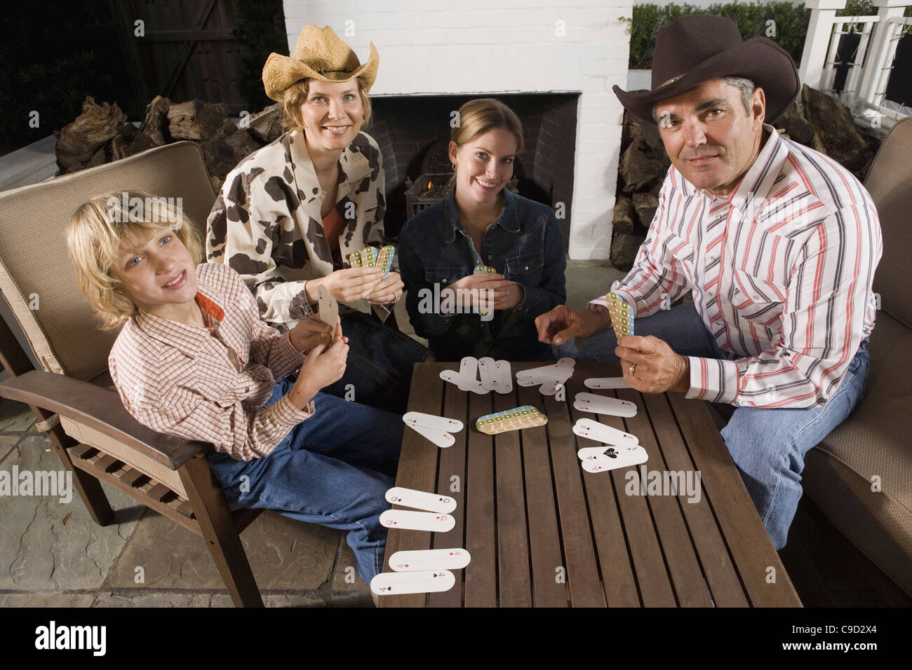 Portrait of a country family playing card game Stock Photo - Alamy