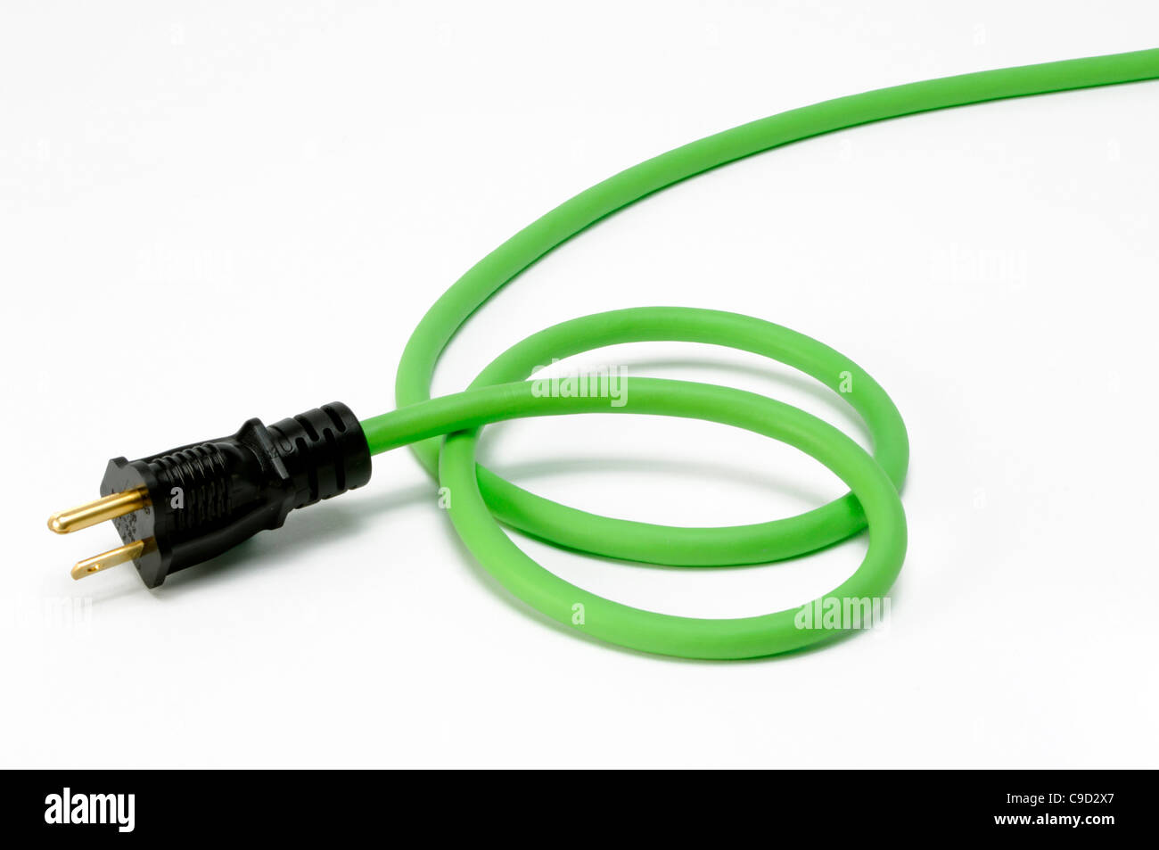 Green electrical power cord and black plug Stock Photo - Alamy