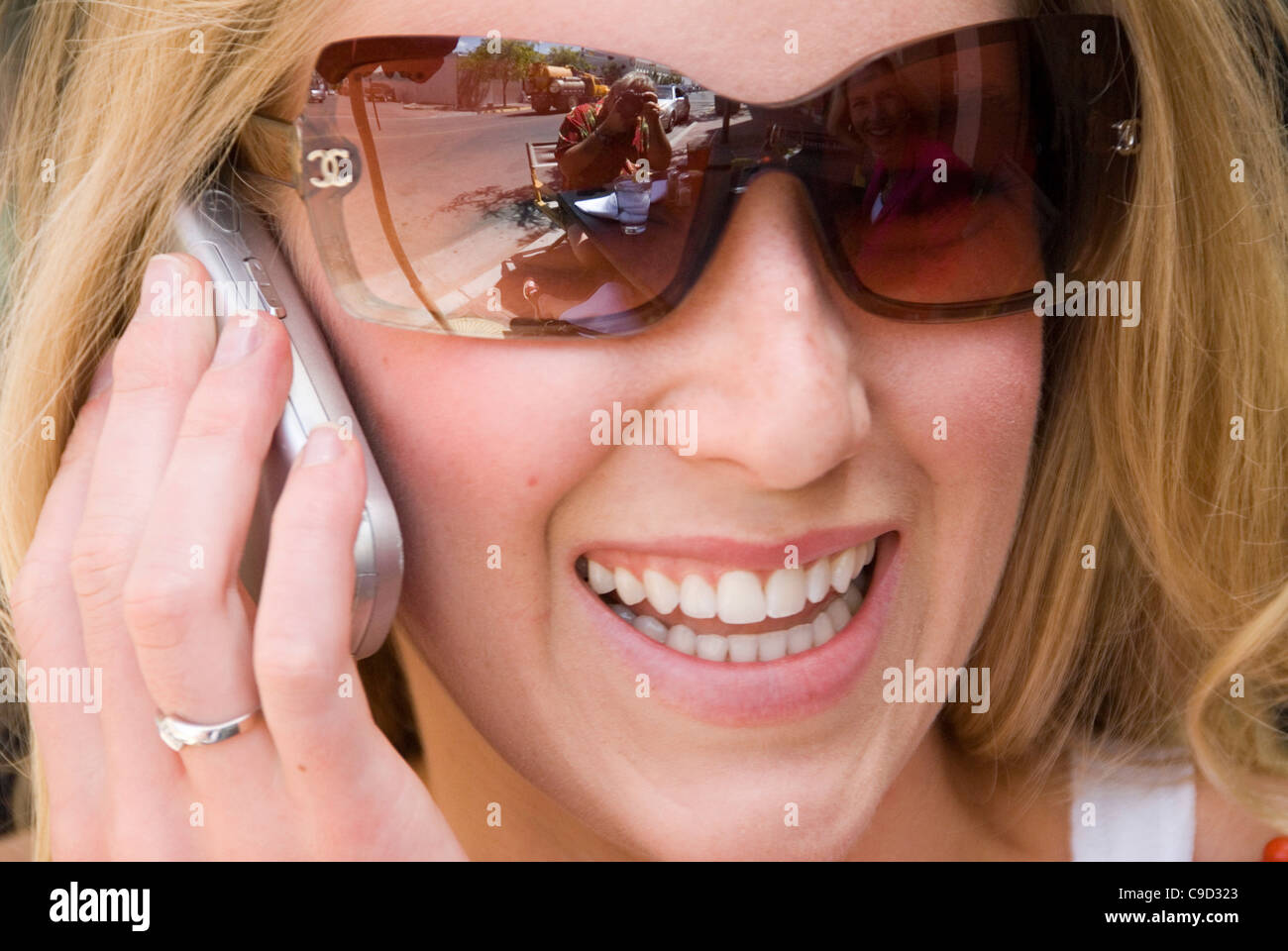 Close-up of a young woman talking on a mobile phone Stock Photo - Alamy