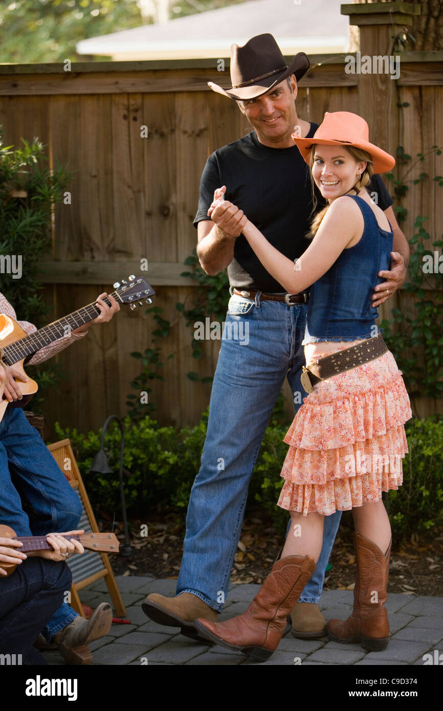 Family playing country music and dancing Stock Photo - Alamy