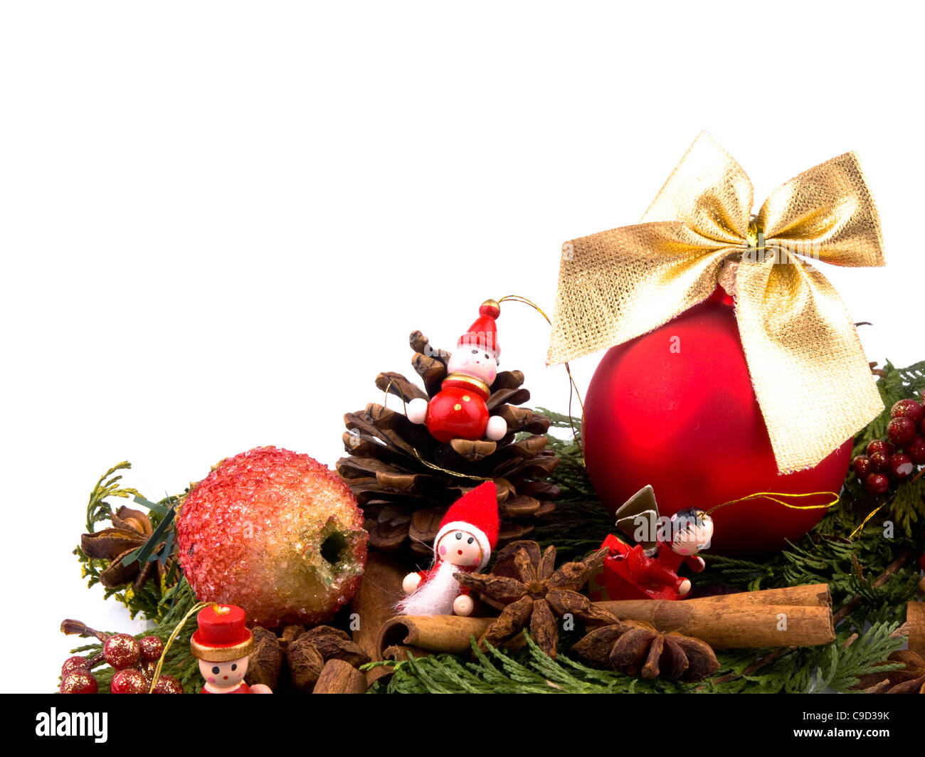 Closeup picture of thuja branches, red glass ball, spices and small ...