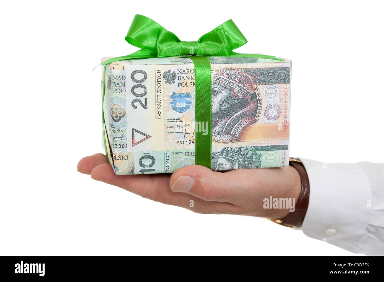 package with money and green ribbon on palm Stock Photo - Alamy