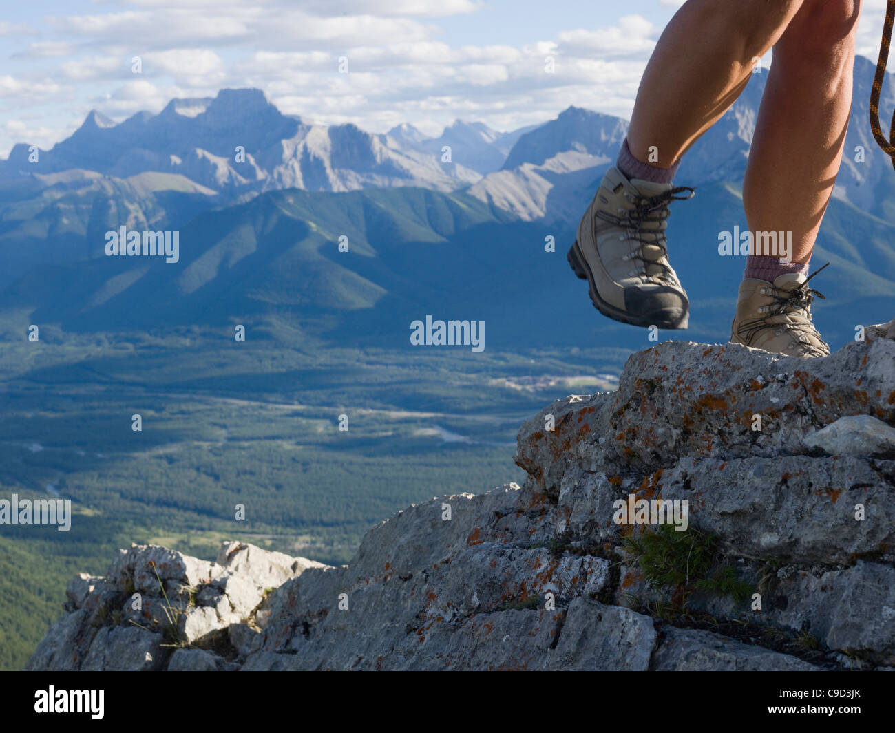 Canada, Alberta, Banff National Park, Hiker's legs ascending rock ridge ...