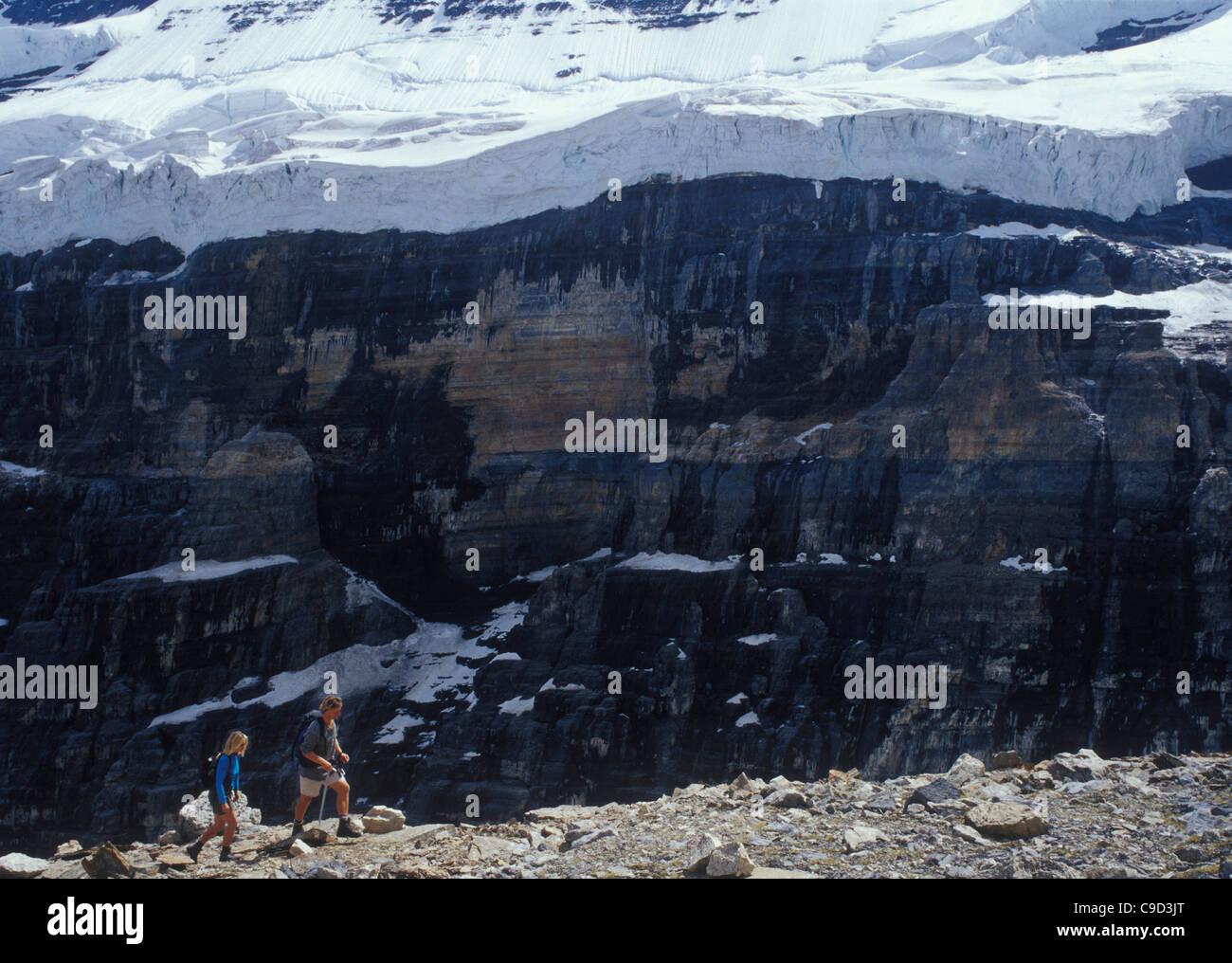 Canada, Alberta, Banff National Park, Hikers climbing along rocky edge ...