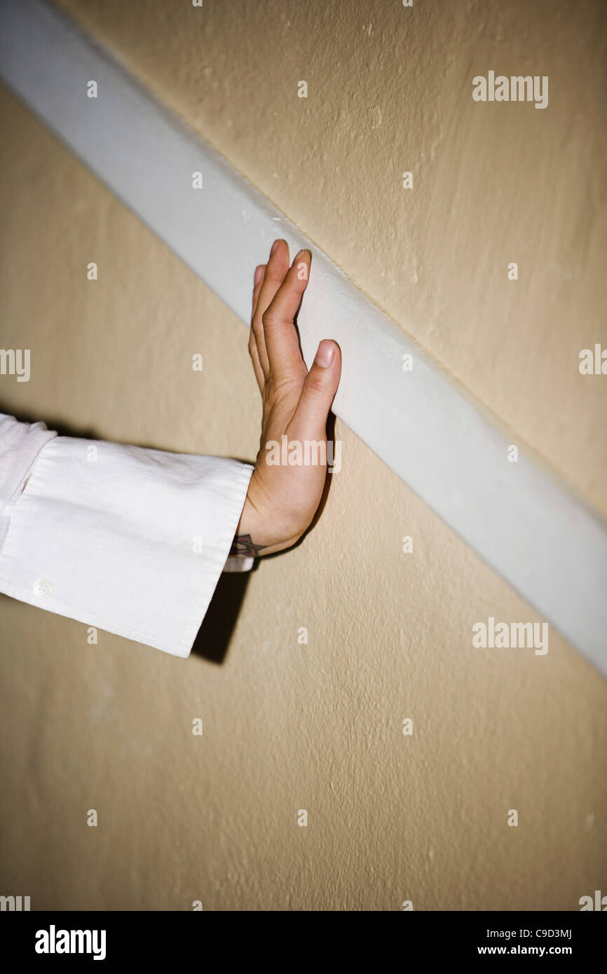 View of woman's hands touching the wall Stock Photo - Alamy