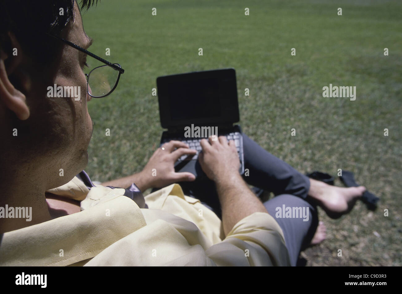 High angle view of a businessman working on a laptop computer Stock ...
