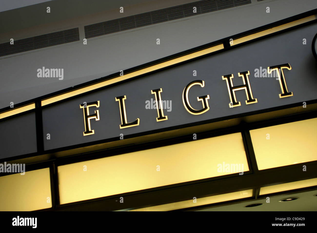 Flight sign lit up on a building Stock Photo - Alamy