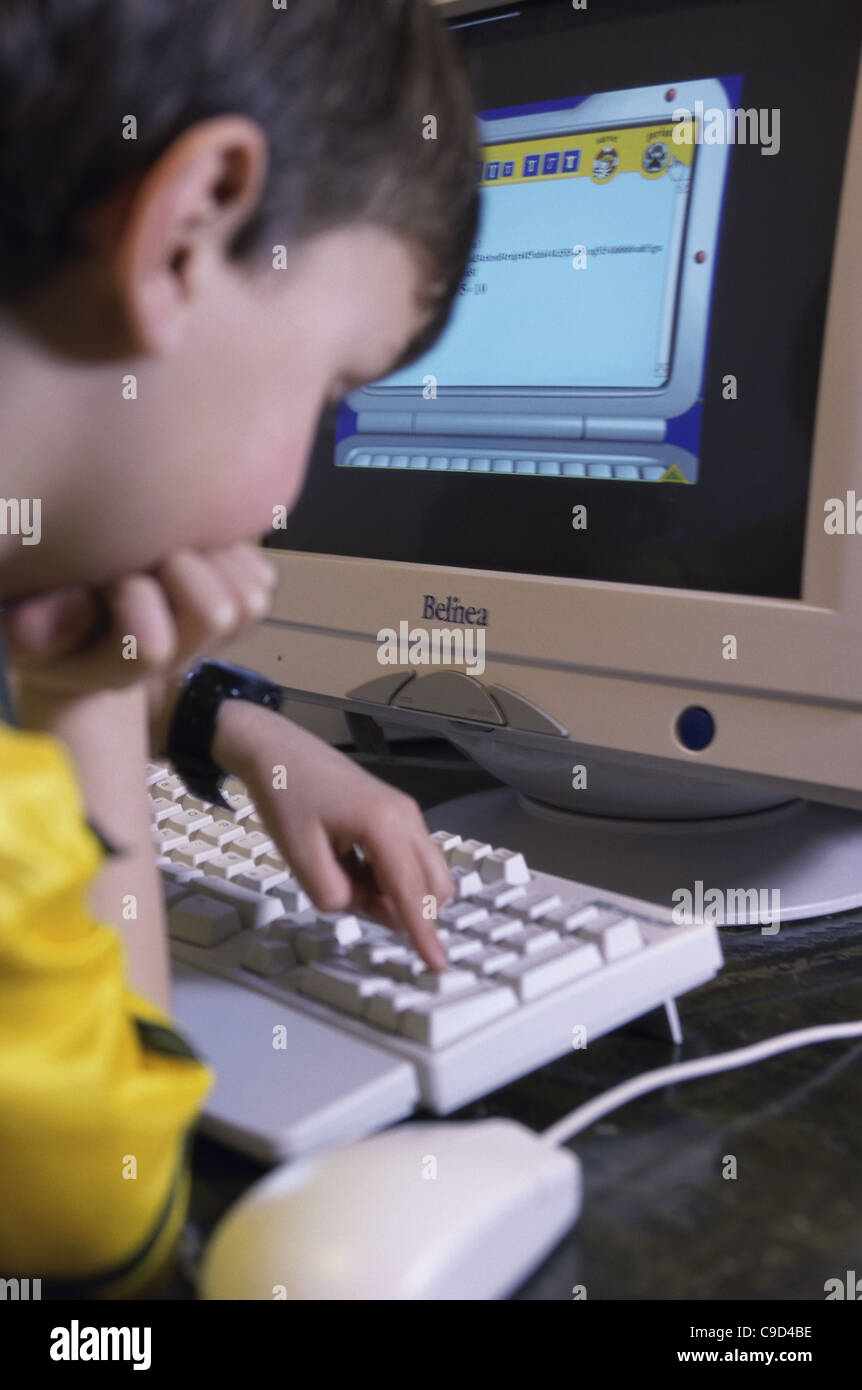Boy using a computer Stock Photo - Alamy