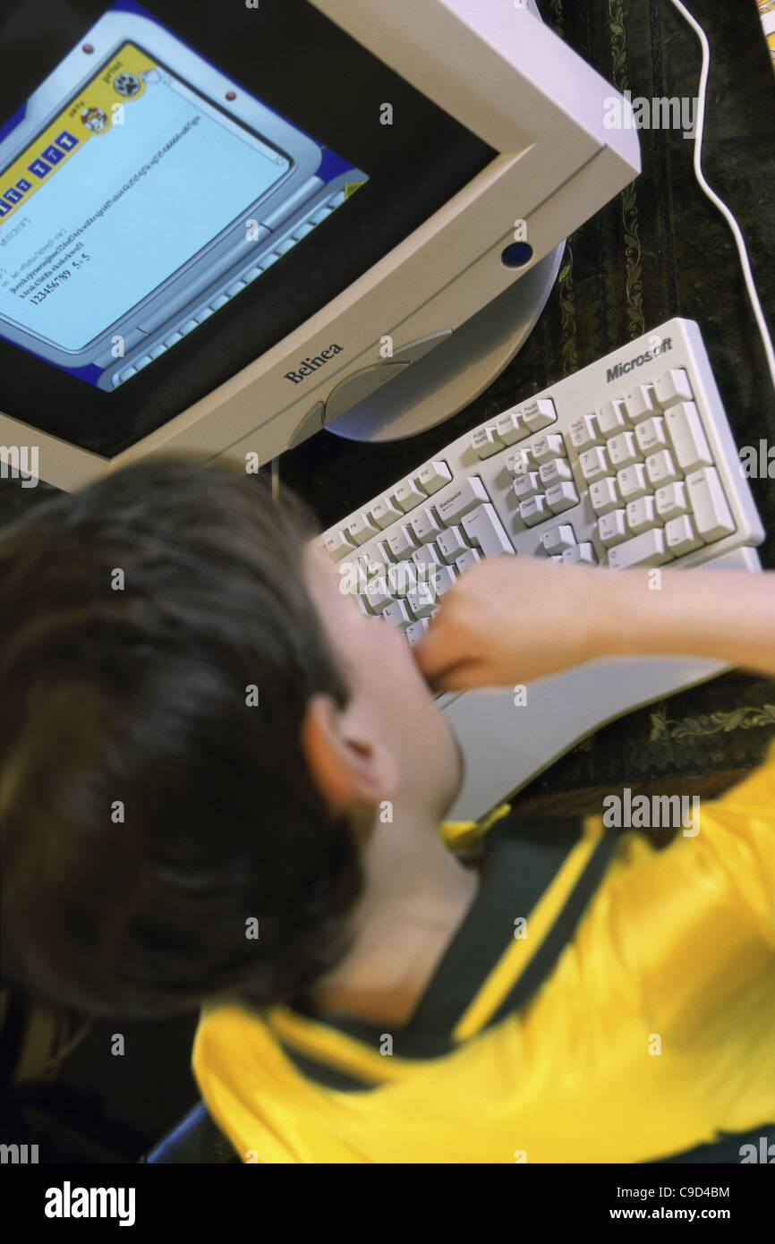 Boy using a computer Stock Photo - Alamy