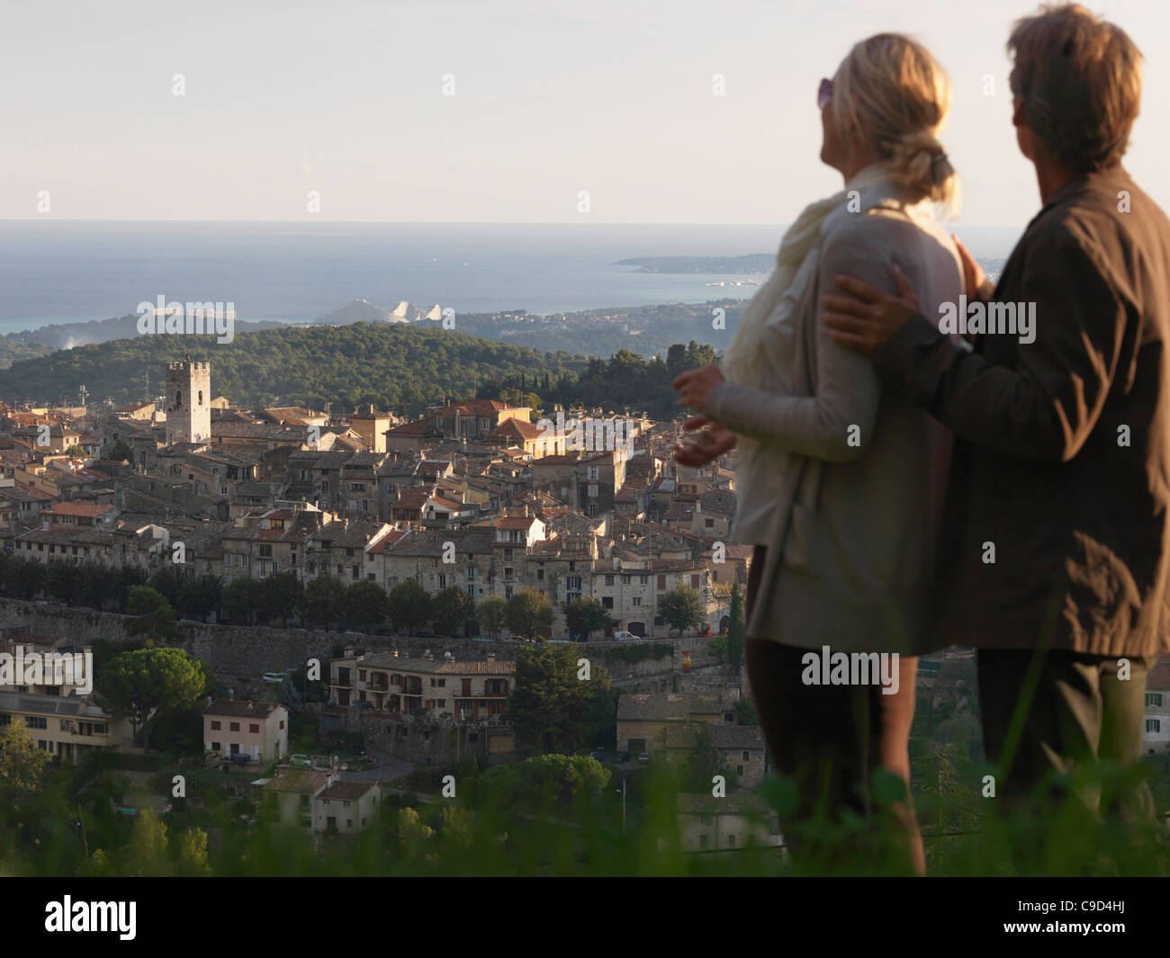 France, Vance, Couple looking over townscape and French Riviera Stock ...