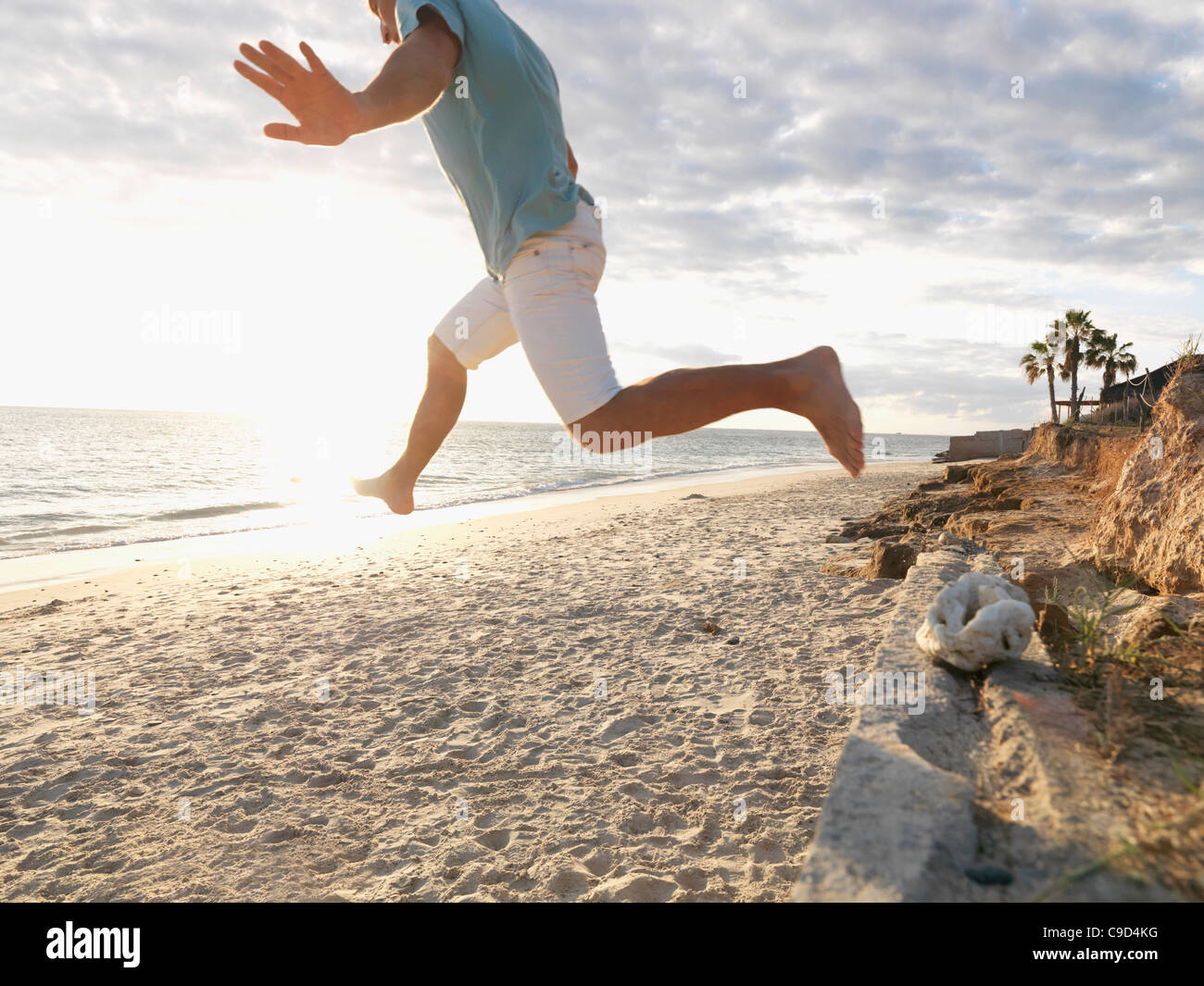 Man jumping over stone wall hi-res stock photography and images - Alamy