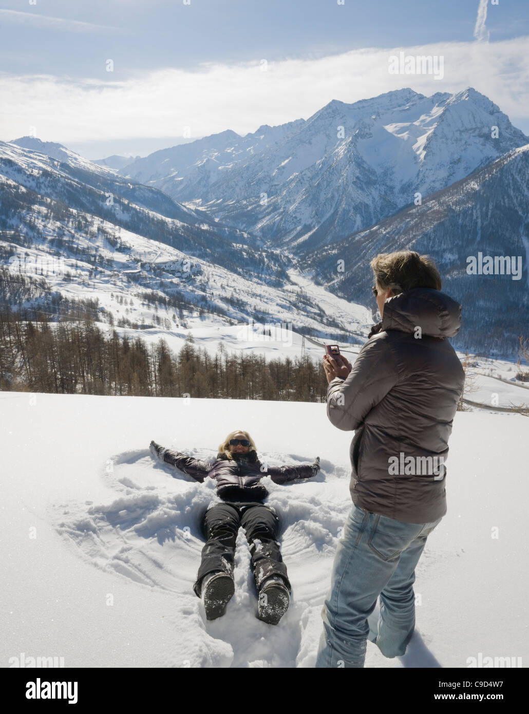 Man lying down making snow hi-res stock photography and images - Alamy