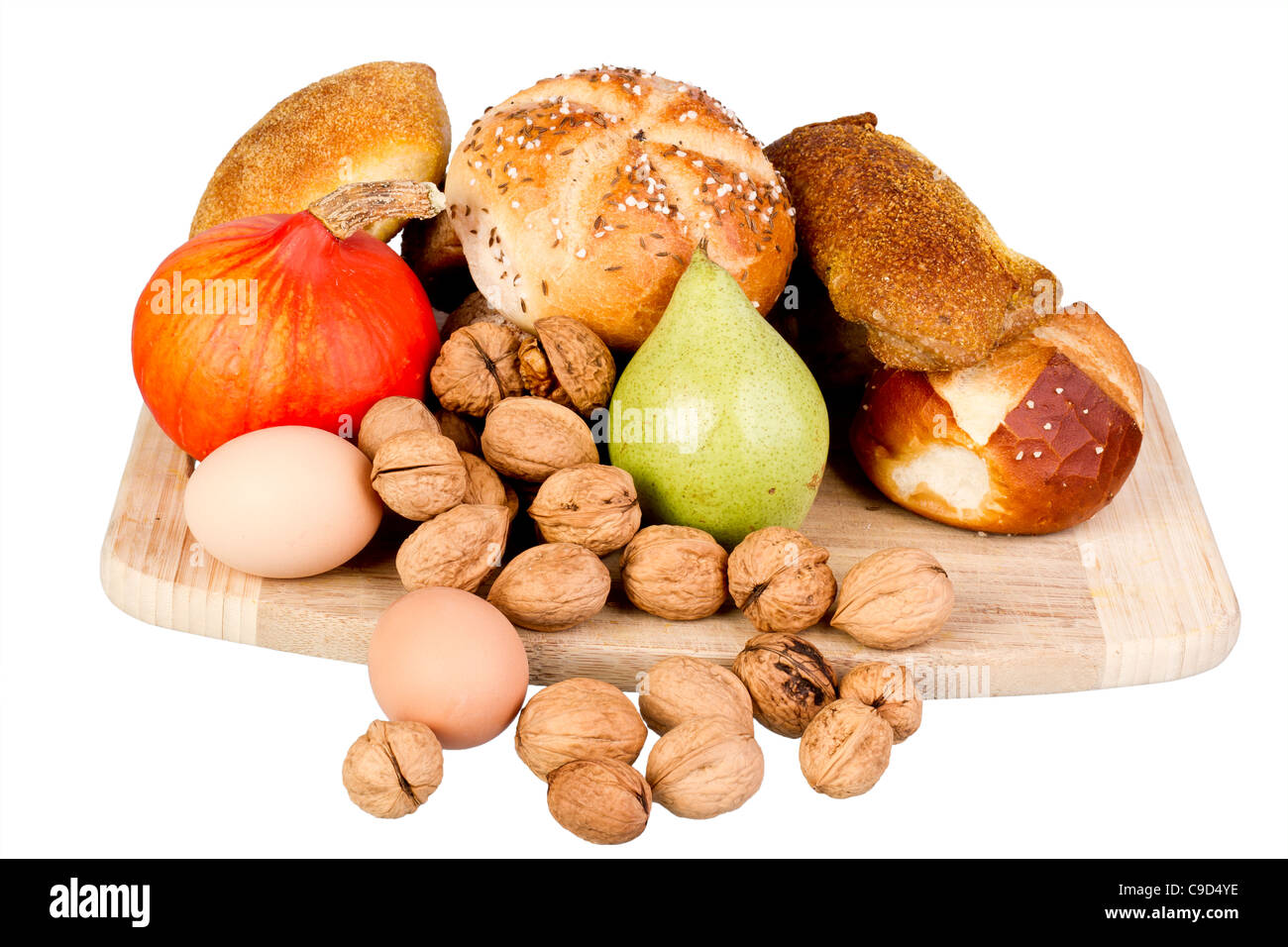 gem, nuts, eggs and a pine on a wooden board. isolated on white ...