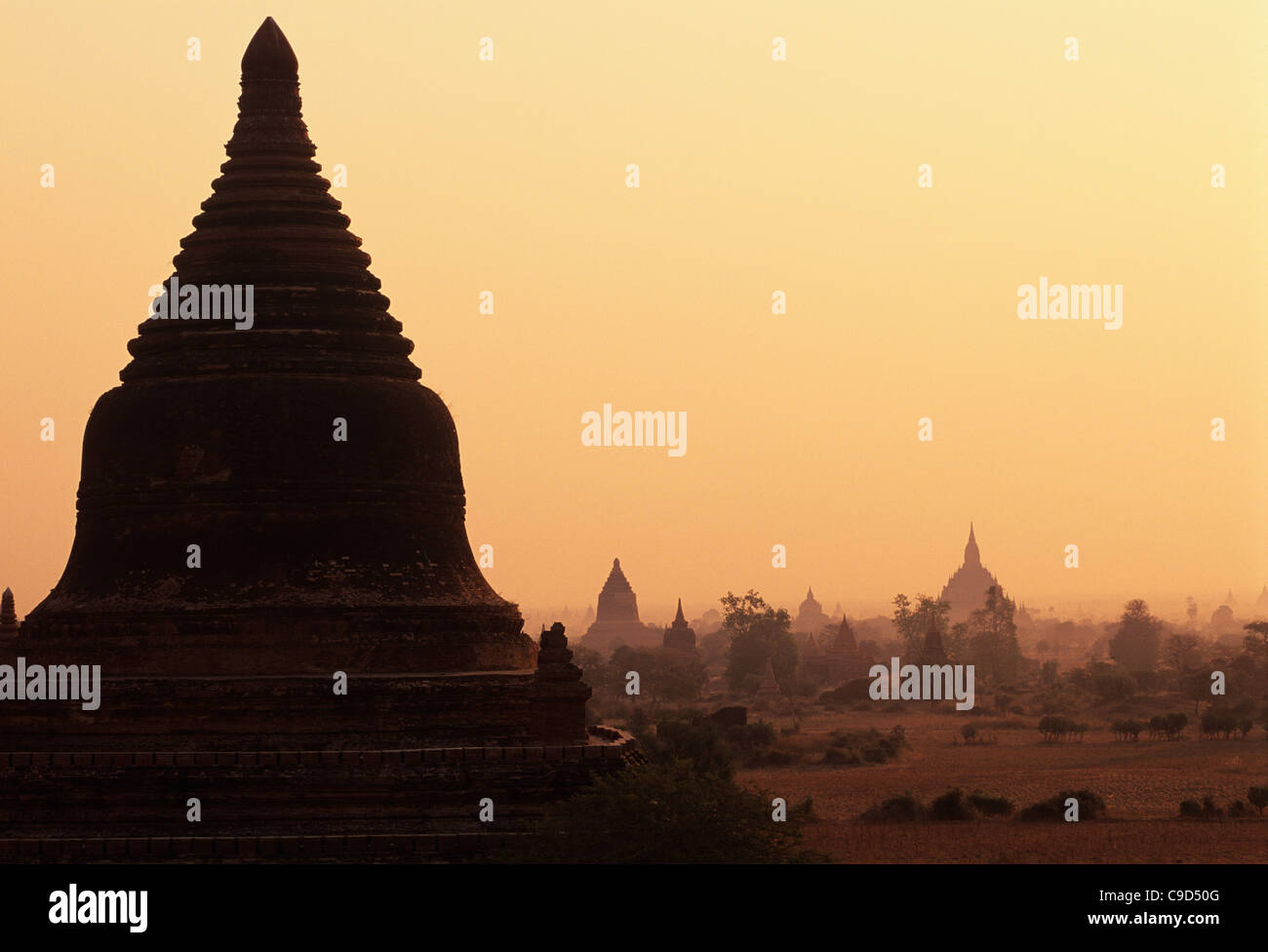 Sunset view of temples at Bagan, Stupa silhouette with other temples in ...