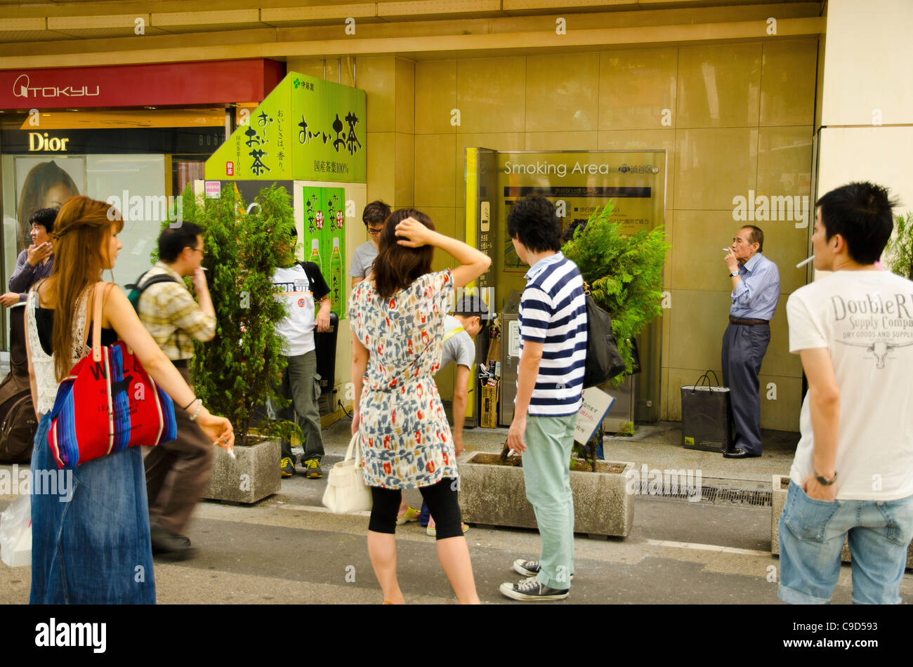 Japan, Tokyo, Akhihabara district, smokers using designated street ...