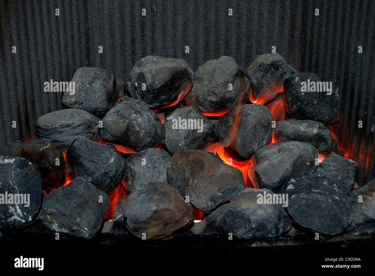 Hot coals glowing red on a fire Stock Photo - Alamy