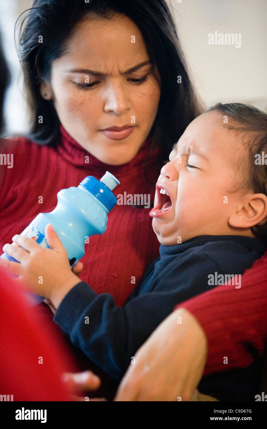Mother holding crying little boy Stock Photo - Alamy Mother holding crying little boy Stock Photo - Alamy