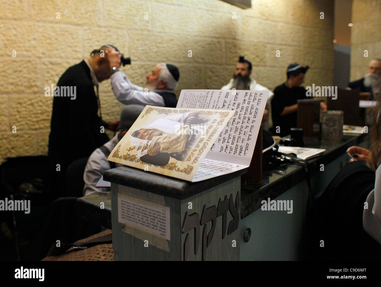 A religious Jew from Habad Lubavitch movement helps a Jewish passenger ...