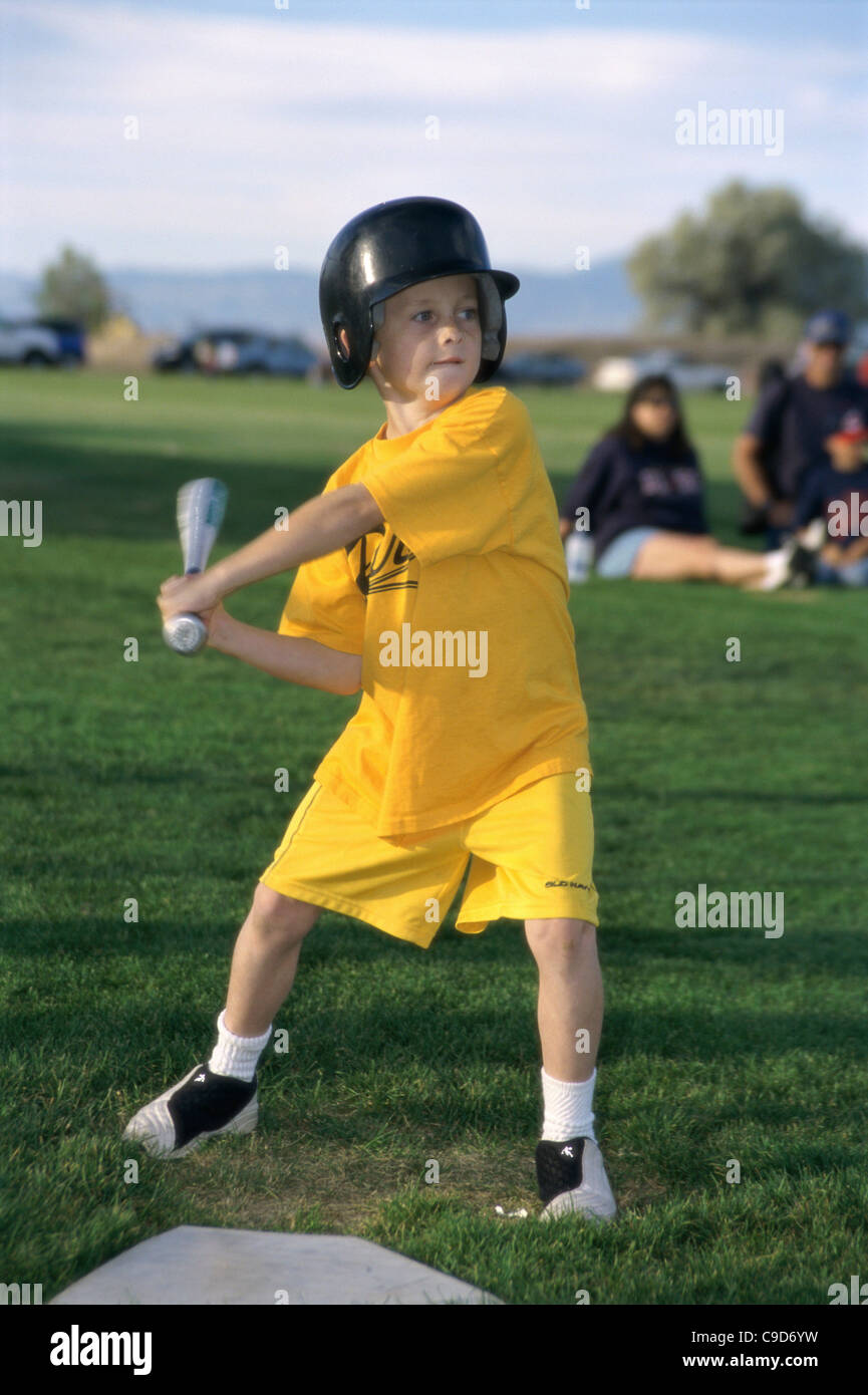 Boy playing baseball Stock Photo - Alamy
