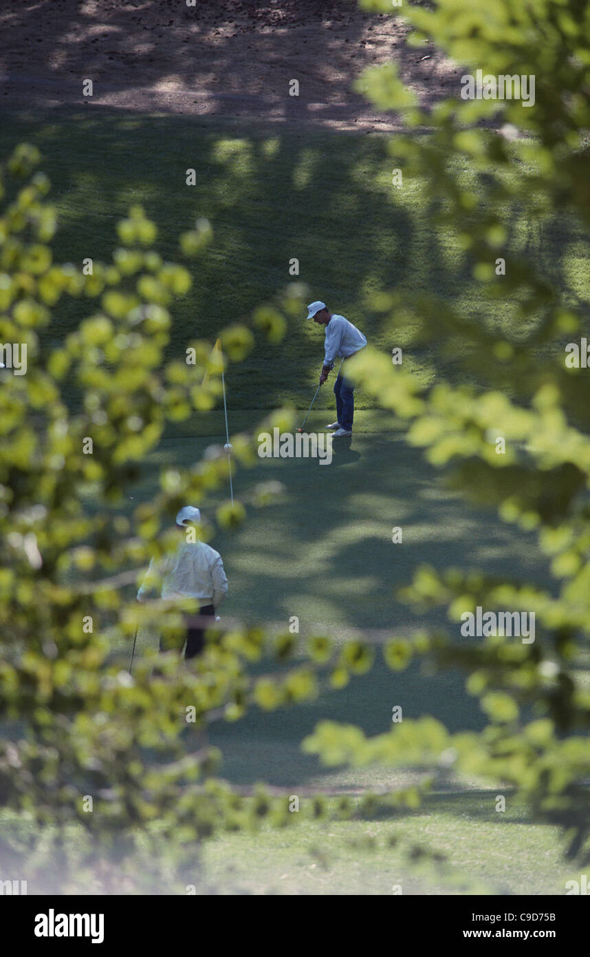 Two people playing golf Stock Photo - Alamy