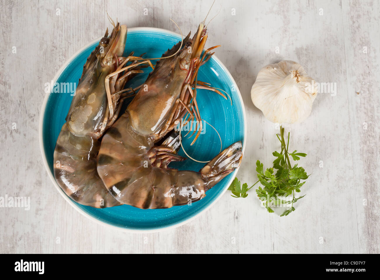 Fresh raw big prawn on a blue plate Stock Photo - Alamy