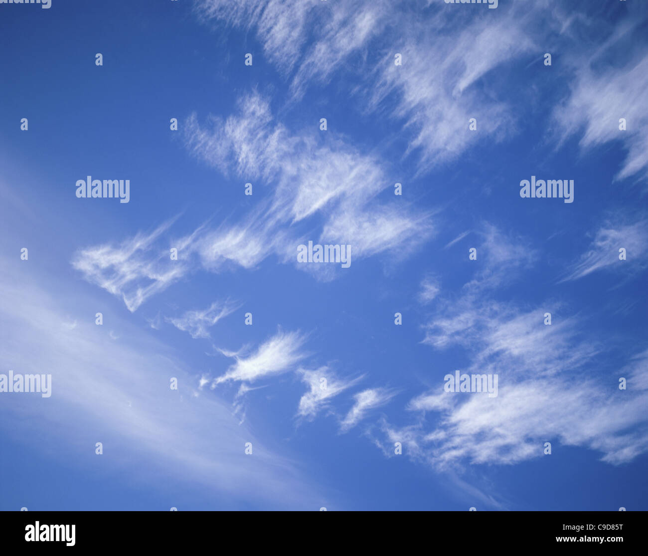 Wispy clouds in a blue sky Stock Photo - Alamy