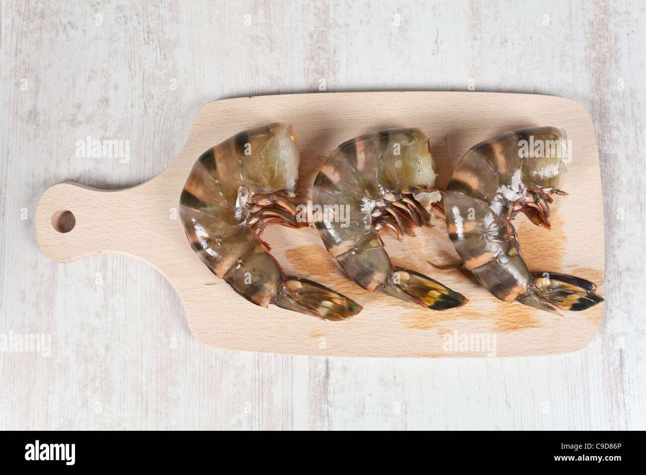 Fresh raw big prawn tail on woden background Stock Photo - Alamy