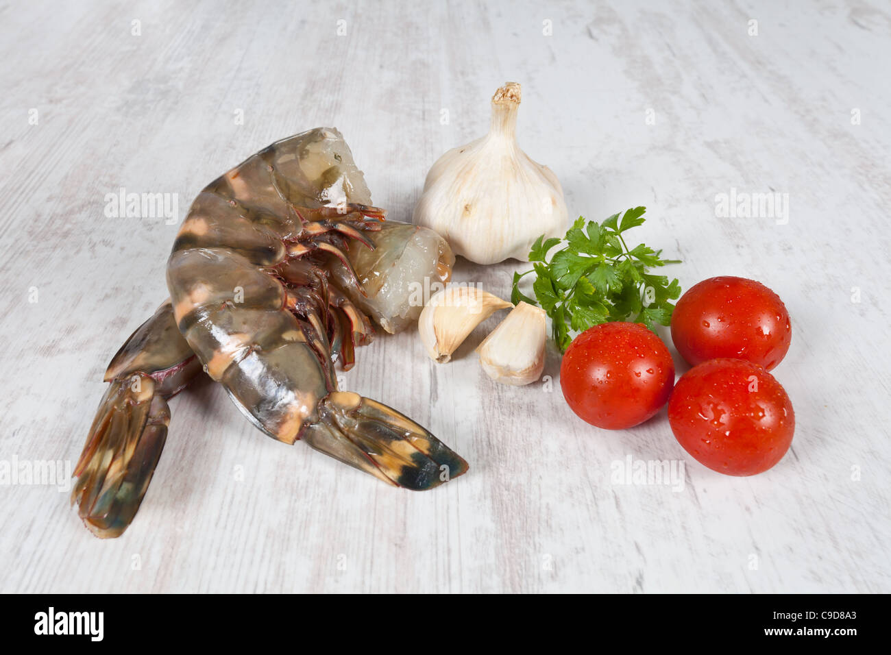 Fresh raw big prawn tails on woden background Stock Photo - Alamy