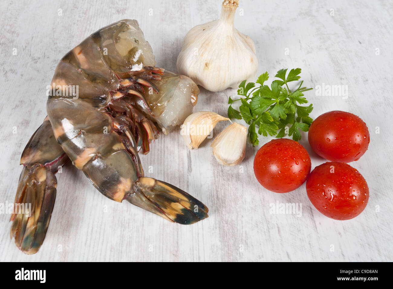 Fresh raw big prawn tails on woden background Stock Photo - Alamy