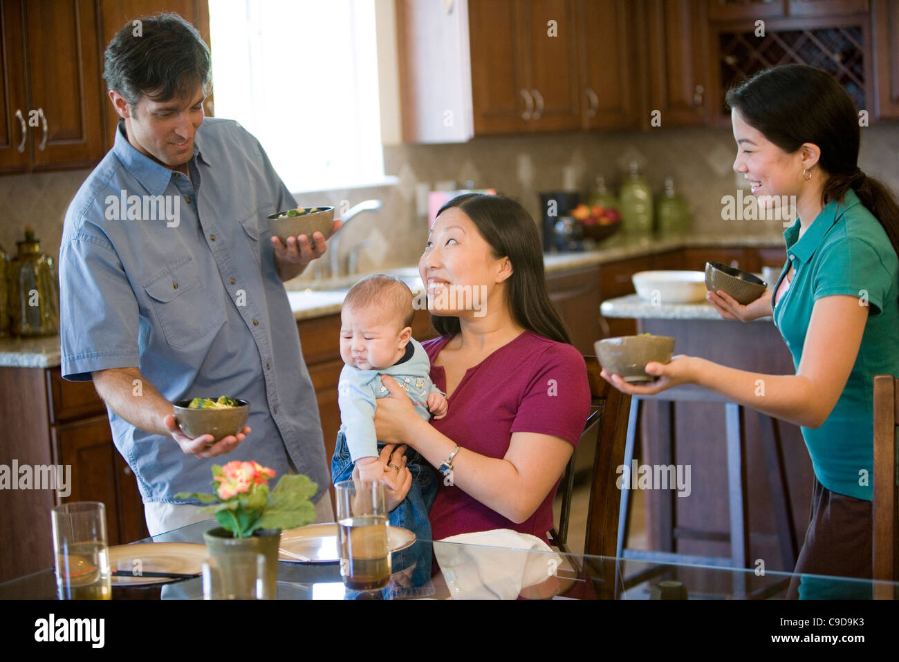 Family eating in kitchen Stock Photo - Alamy