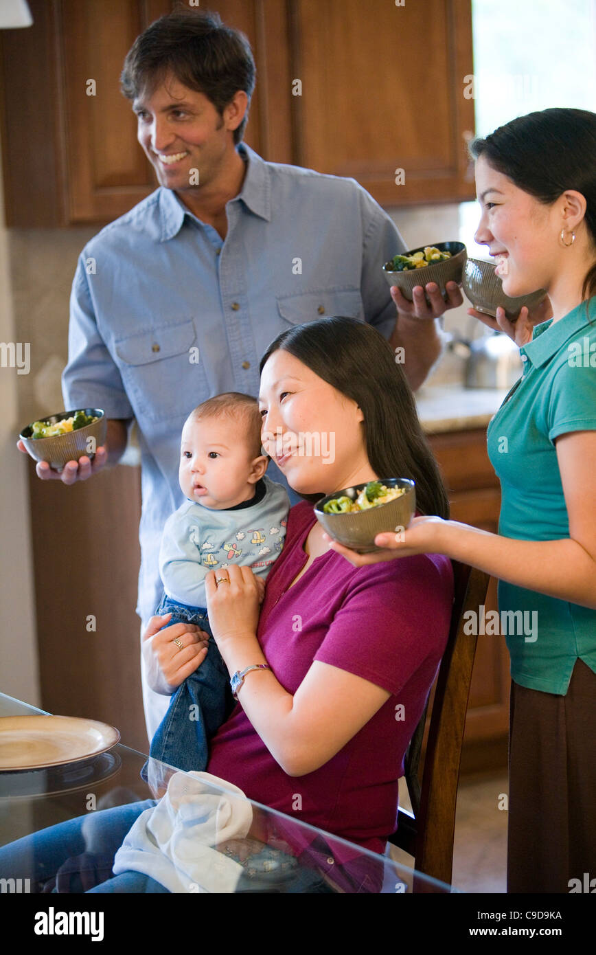 Family eating in kitchen Stock Photo - Alamy