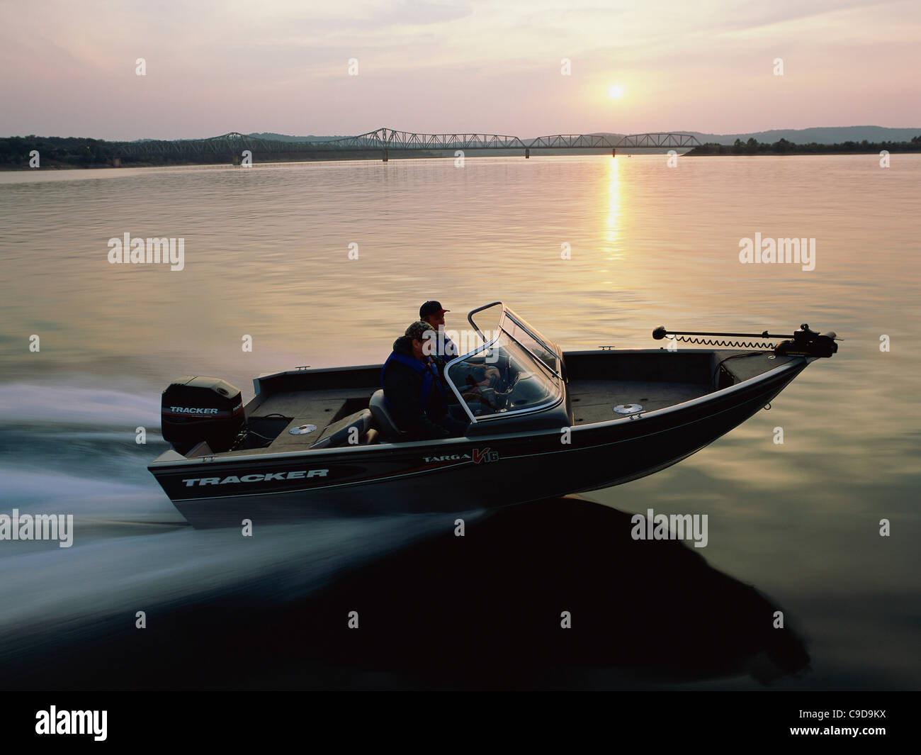 Two people in a motorboat Stock Photo - Alamy
