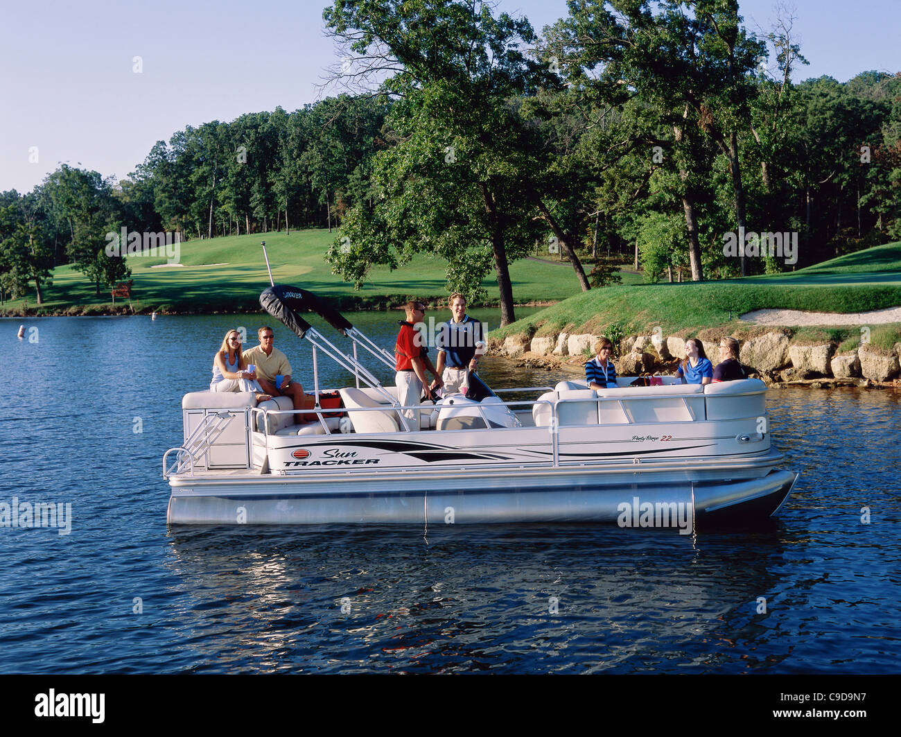 Group of people in a motorboat Stock Photo - Alamy