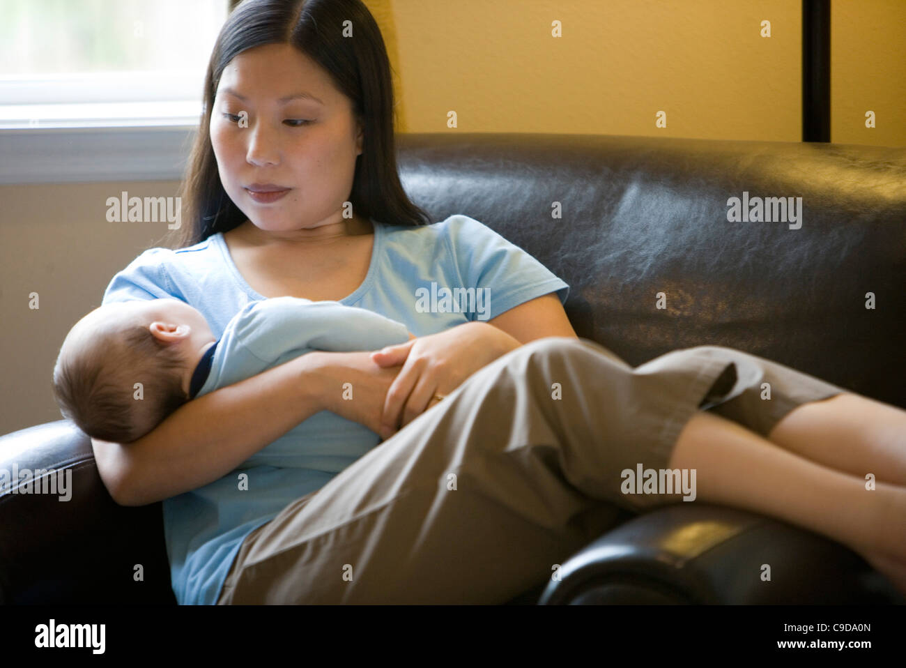 Infant sitting on a chair infant sitting on a chair hi-res stock ...