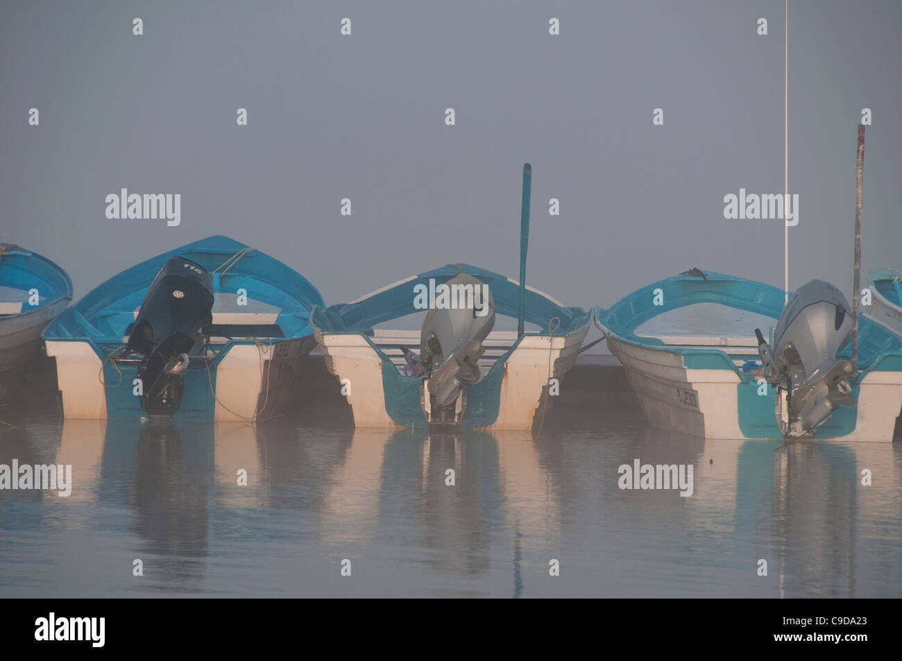 Mexico, Baja California Sur, Puerto Lopez Mateos, morning fog and boats ...