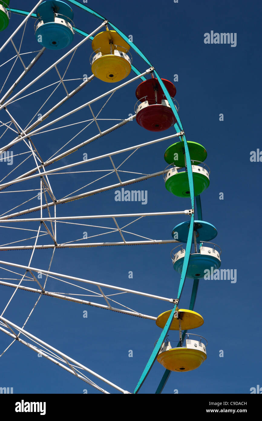 Colorful cars with canopies on a fairground ferris wheel ride Stock ...