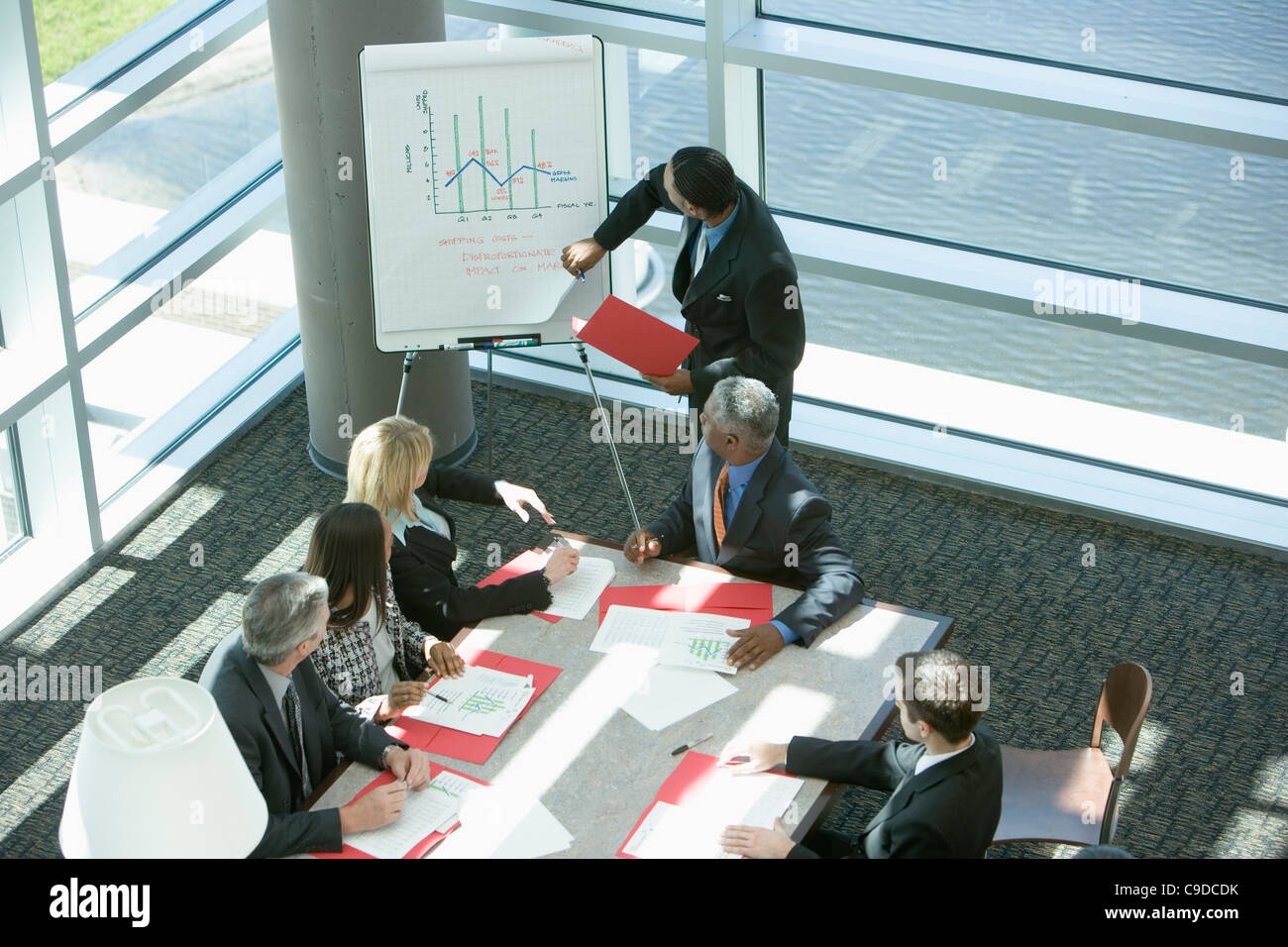 Overhead view of business colleagues in a meeting Stock Photo - Alamy