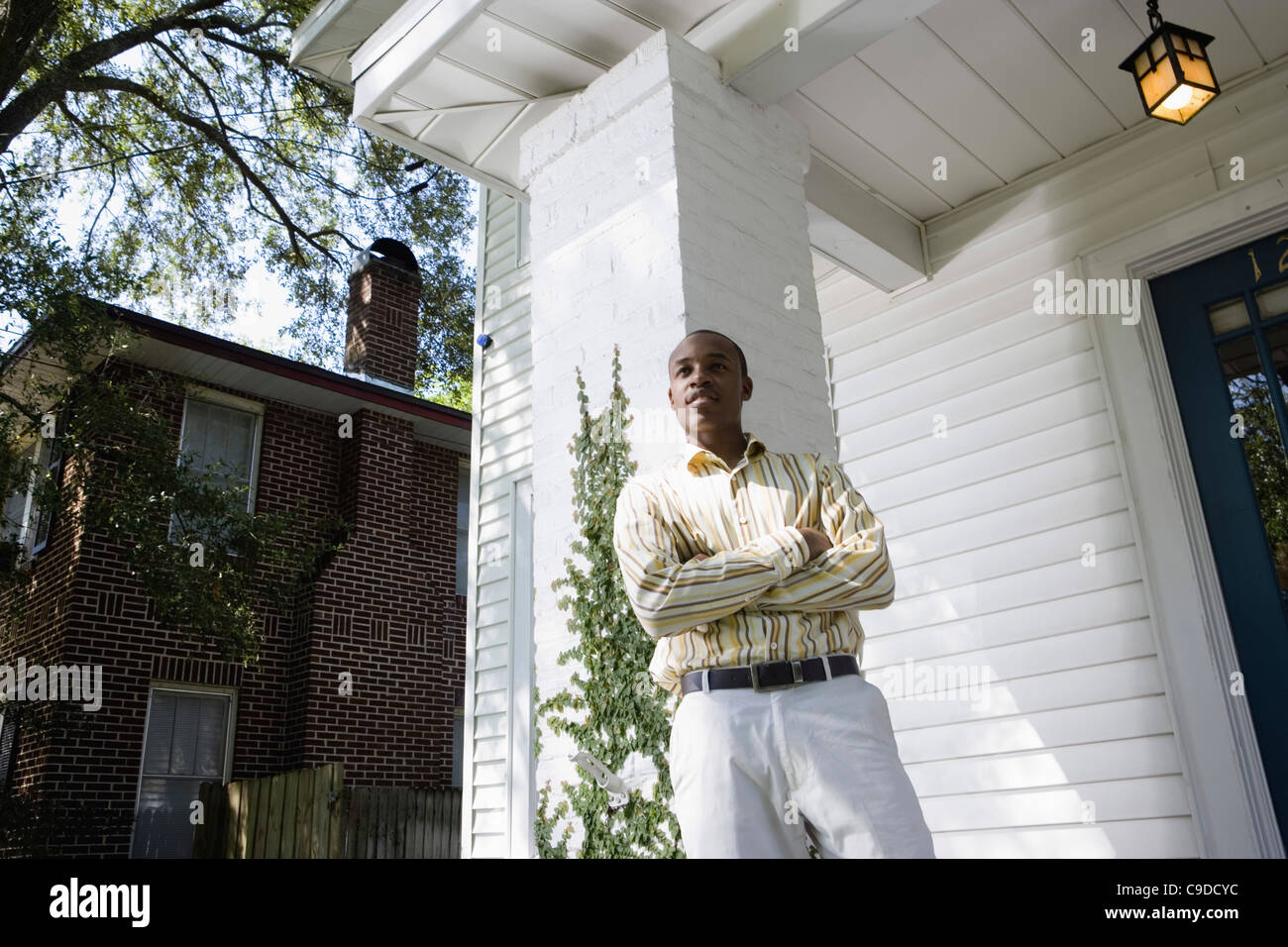 Man standing outside a house hi-res stock photography and images - Alamy