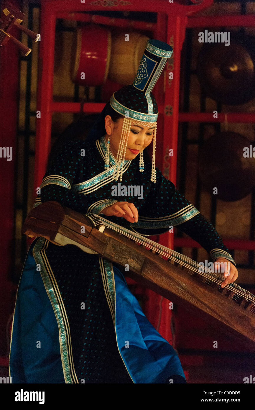 Musician of Tumen Ekh ensemble performs traditional mongolian music in ...