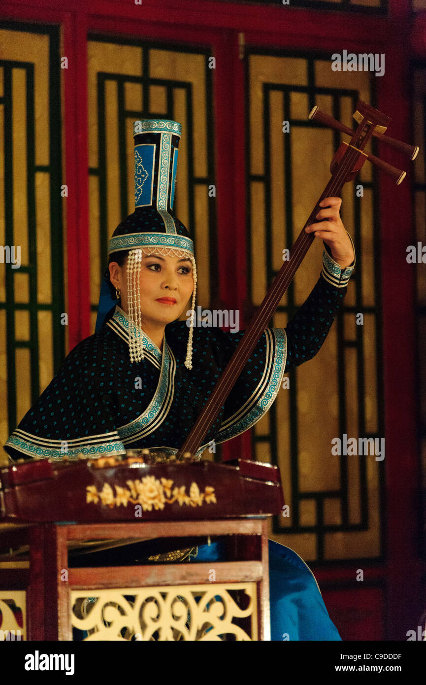 Musician of Tumen Ekh ensemble performs traditional mongolian music in ...
