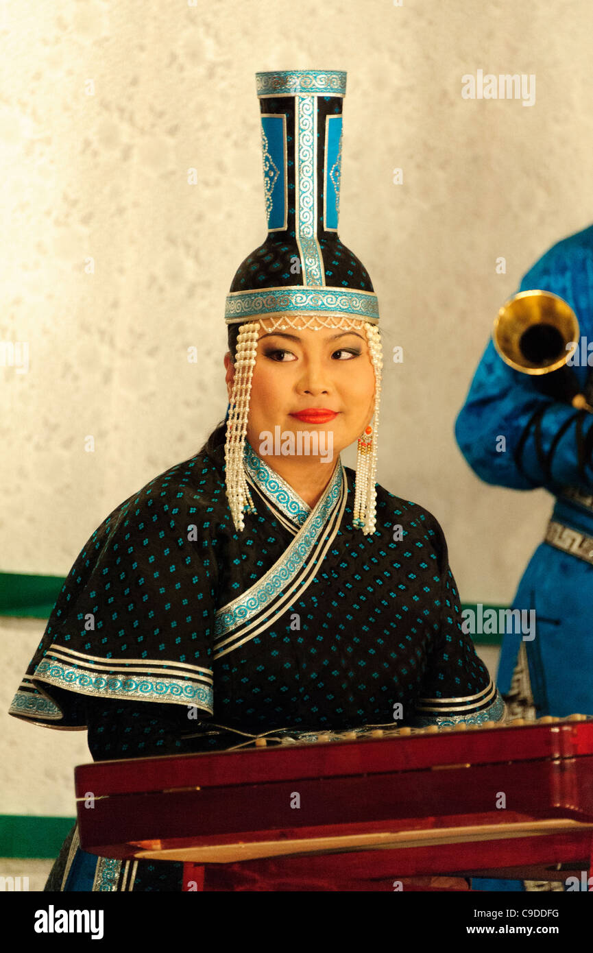 Musician of Tumen Ekh ensemble performs traditional mongolian music in ...