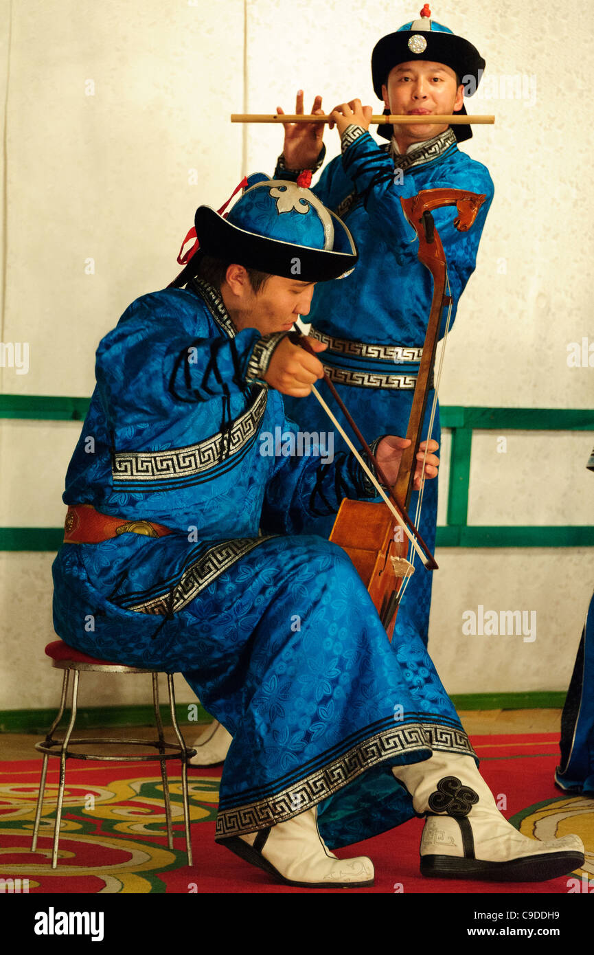 Musician of Tumen Ekh ensemble performs traditional mongolian music in ...