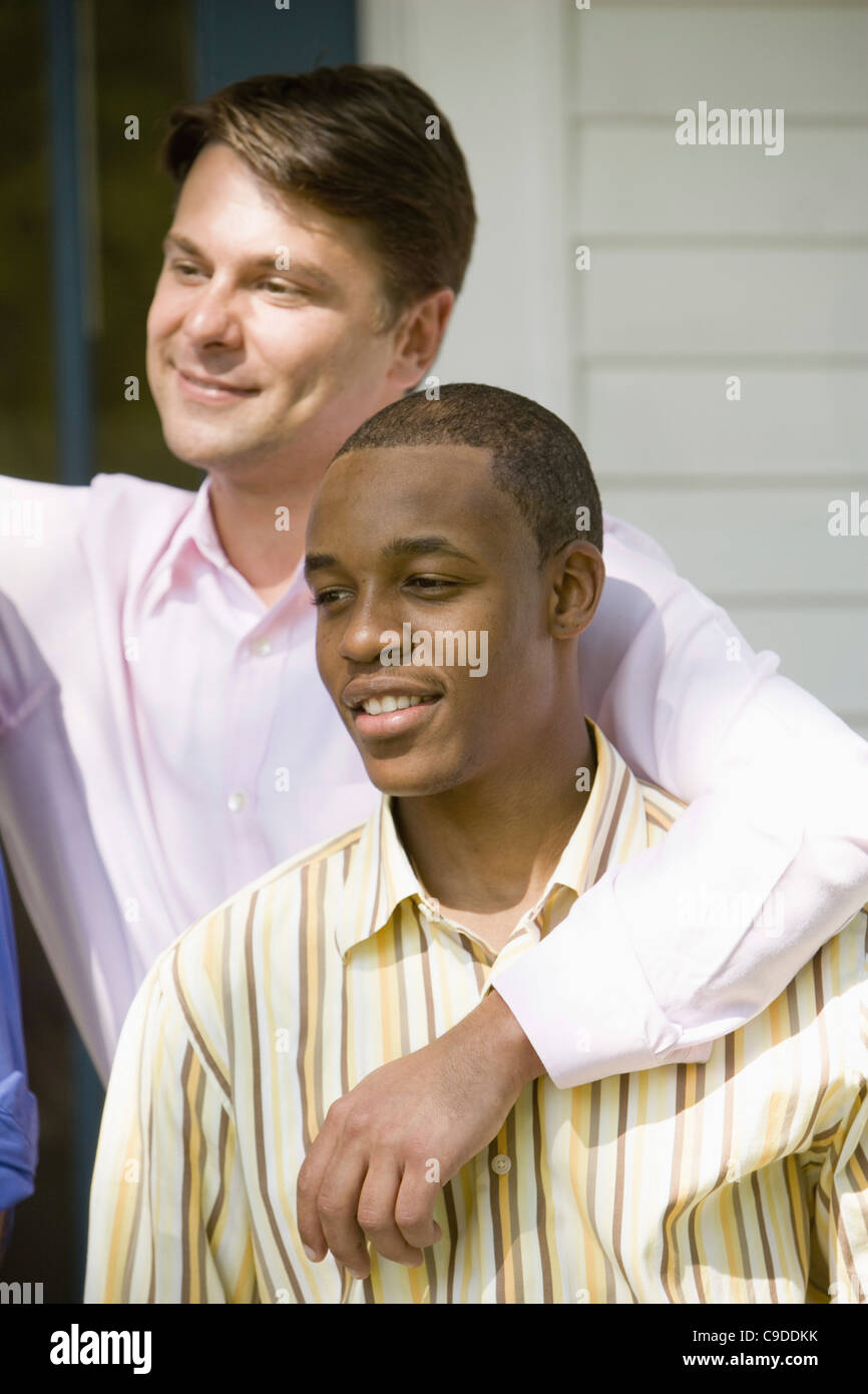 Two young men standing together Stock Photo - Alamy