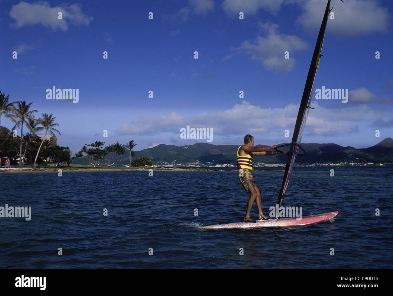 Young man windsurfing Stock Photo - Alamy