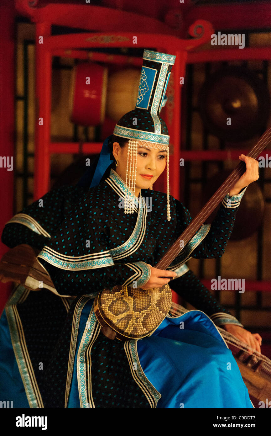 Musician of Tumen Ekh ensemble performs traditional mongolian music in ...