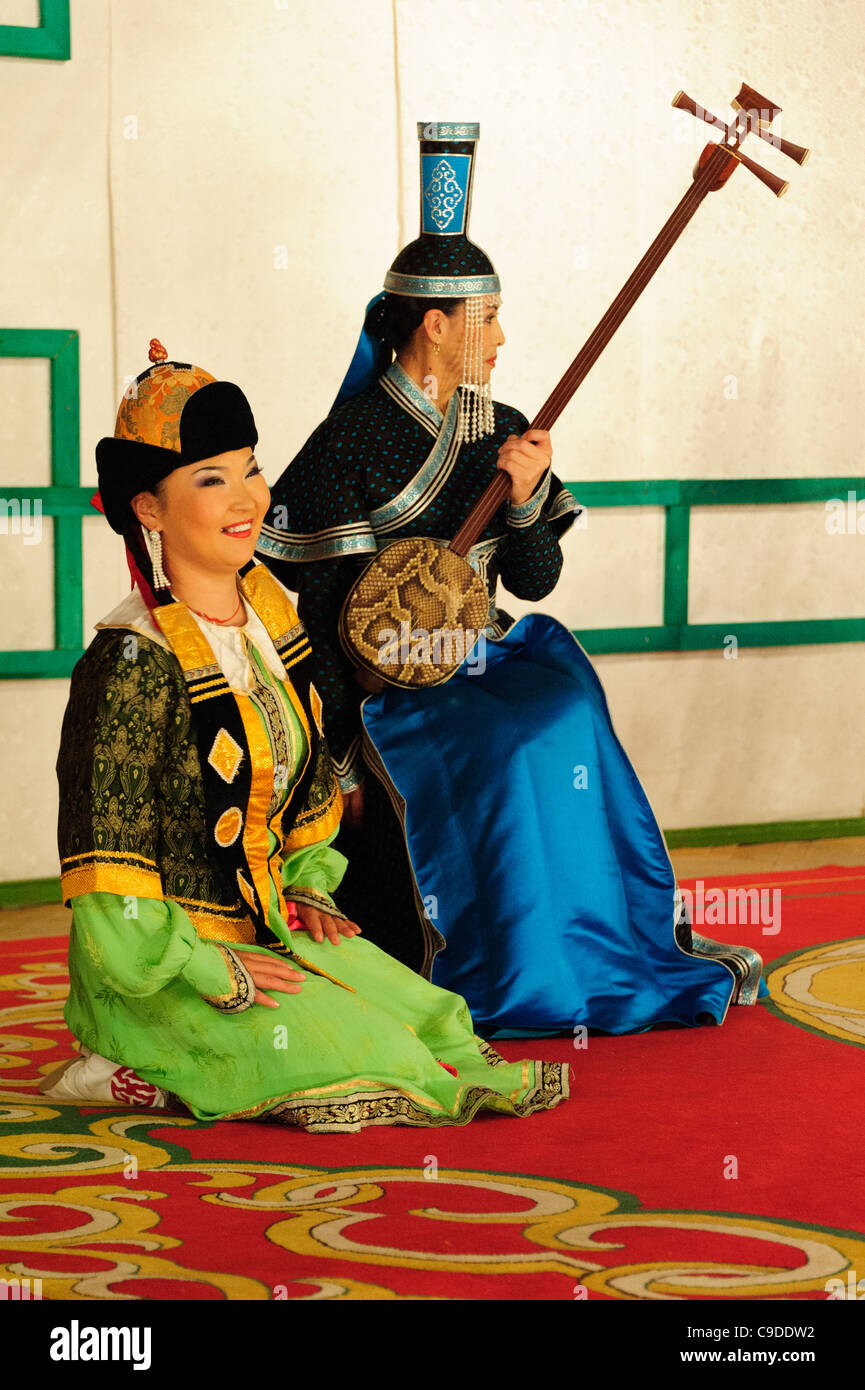Musician of Tumen Ekh ensemble performs traditional mongolian music in ...
