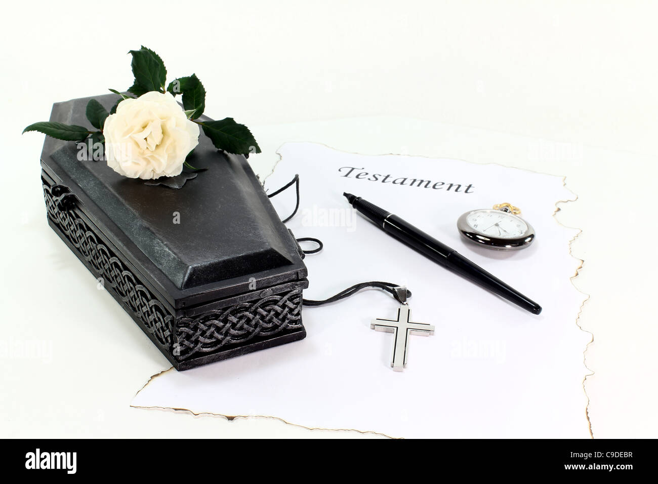 Testament with coffin, a white rose, clock, pen and cross Stock Photo ...