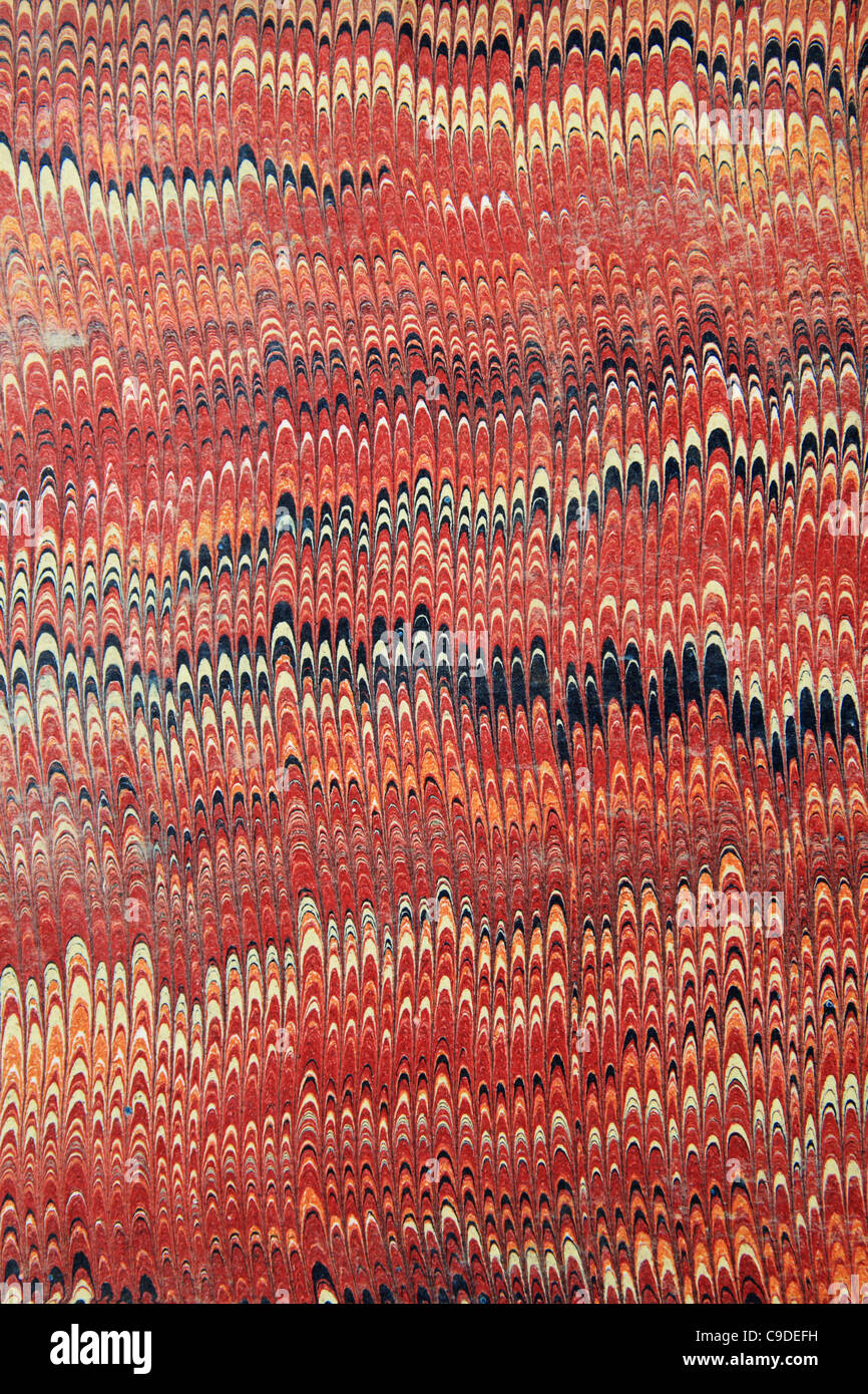 red, yellow, and black marbled paper from an antique book Stock Photo ...